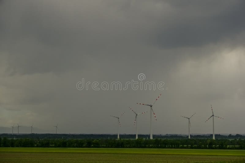 Many Windmills in a Flat Landscape during a Rain Stock Photo - Image of ...