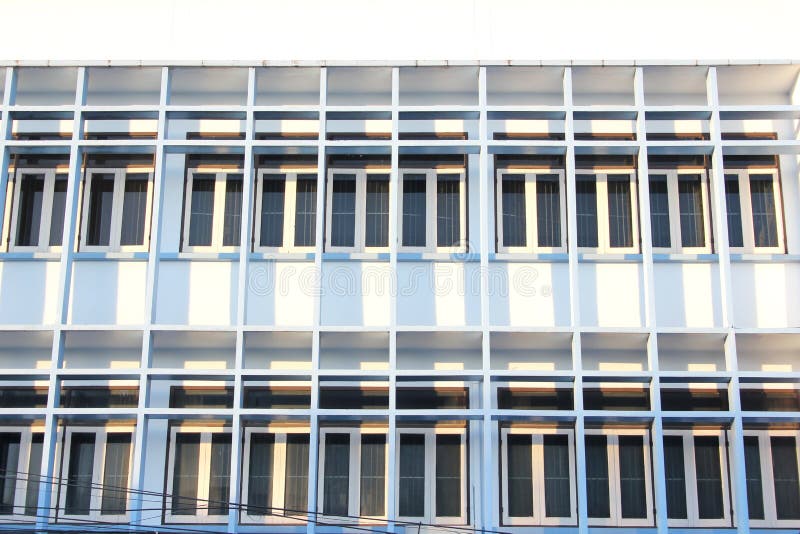 Many Windows on the Blue and White Buildings. Stock Photo - Image of ...