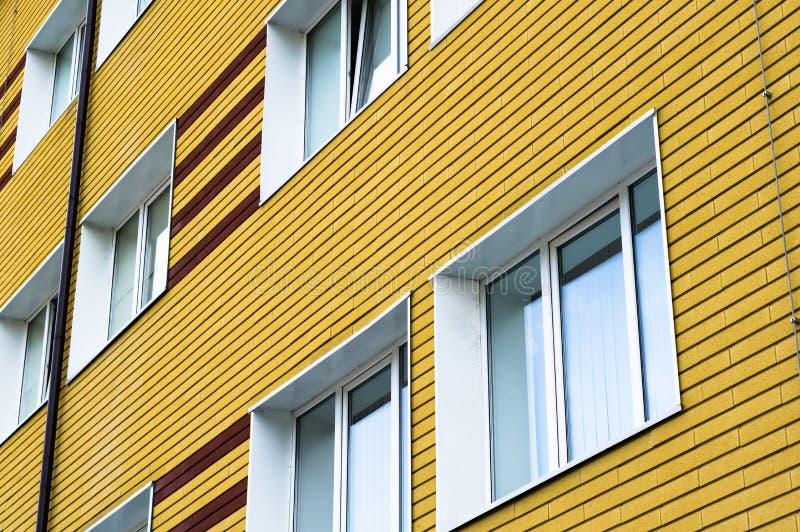 Many Windows in Yellow Building Stock Photo - Image of background ...