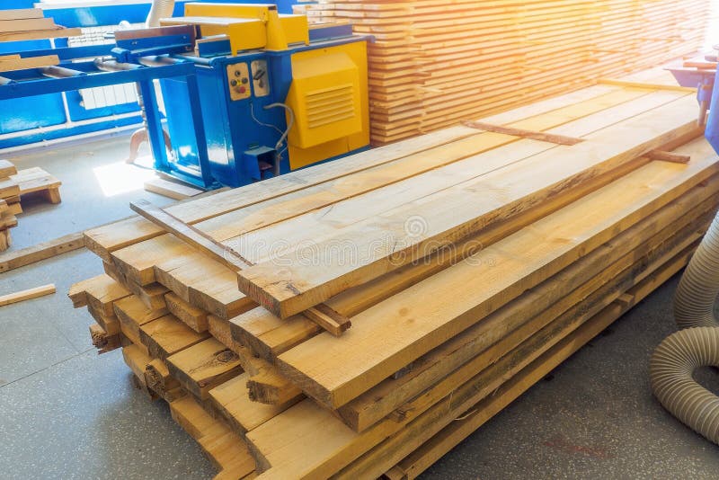 Many Wooden Planks Stacked in Carpentry Workshop. Building Material ...