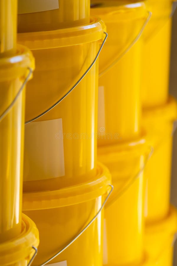 Many Yellow Color Buckets Cans in a Row with Ink Paint Row Stock Photo ...