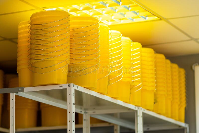 Many Yellow Color Buckets Cans in a Row with Ink Paint Row Stock Image ...