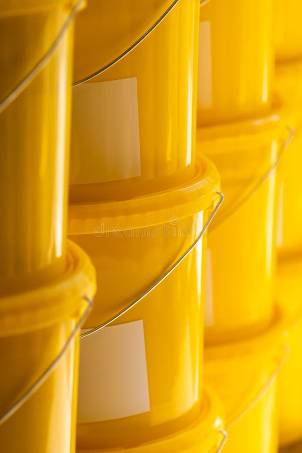 Many Yellow Color Buckets Cans in a Row with Ink Paint Row Stock Image ...