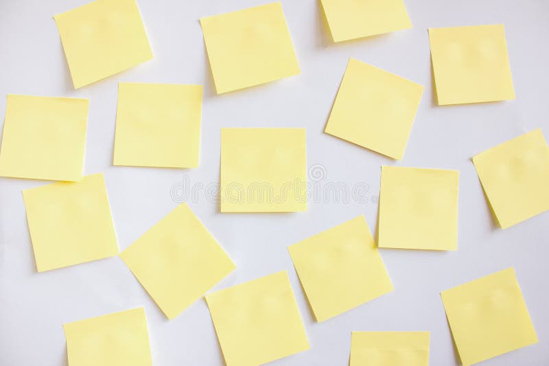 Many Yellow Papers for Notes on a White Wall Stock Image - Image of ...