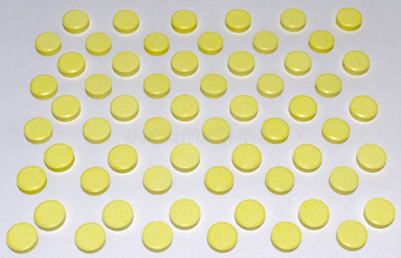 Many Yellow Pills, Arranged in Staggered Order Stock Photo - Image of ...