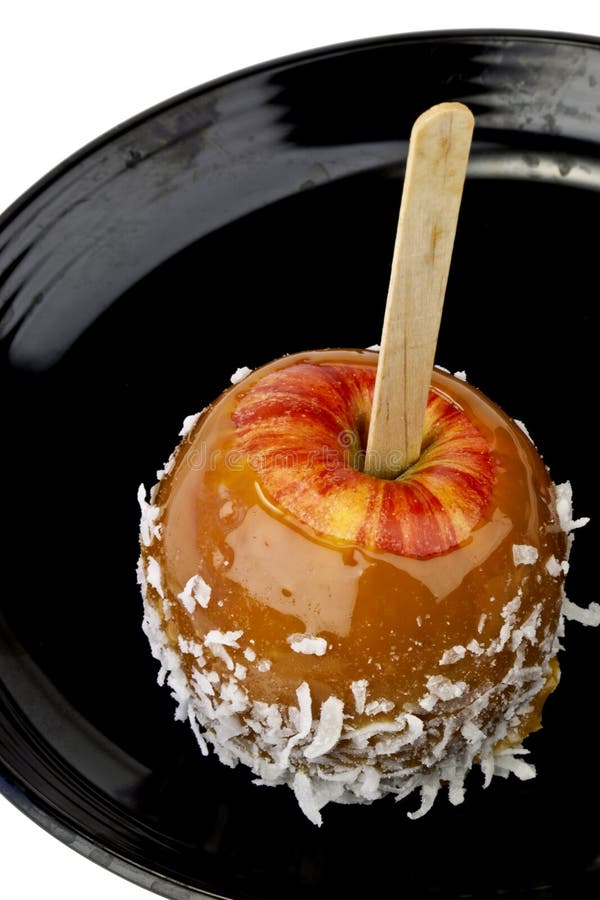 Manzana De Caramelo Con El Desmoche Del Coco Foto de archivo - Imagen ...