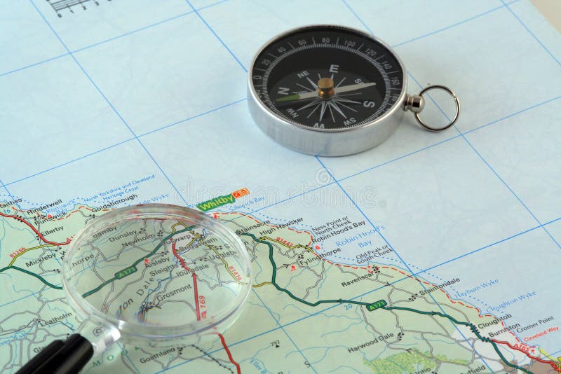Compass and small atlas stock photo. Image of travel, world - 4817848