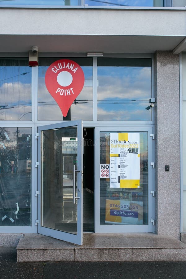 Map Pointer Affixed To the Front Entrance of a Modern Business Building ...