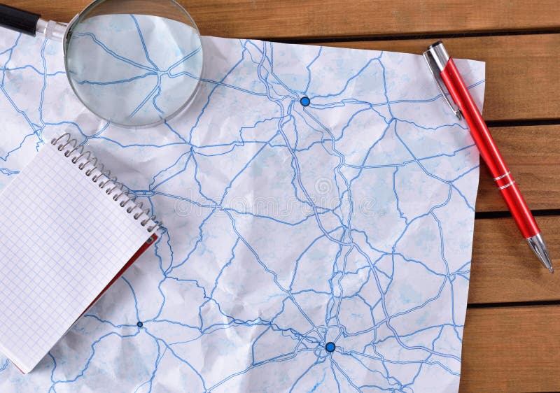 Map with Tracks on a Wooden Table Stock Photo - Image of sheet ...