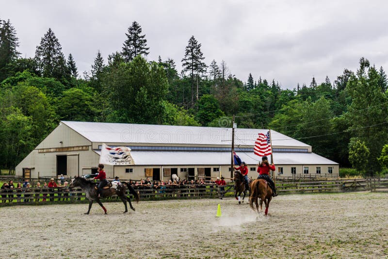 MAPLE RIDGE, CANADA - JULY 5, 2019: Horse Riders with Flags on the ...