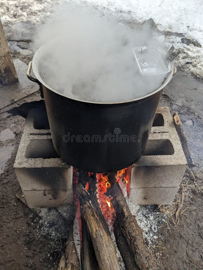 Maple Sap Boiling in a Pot Over a Fire Stock Photo - Image of snow ...