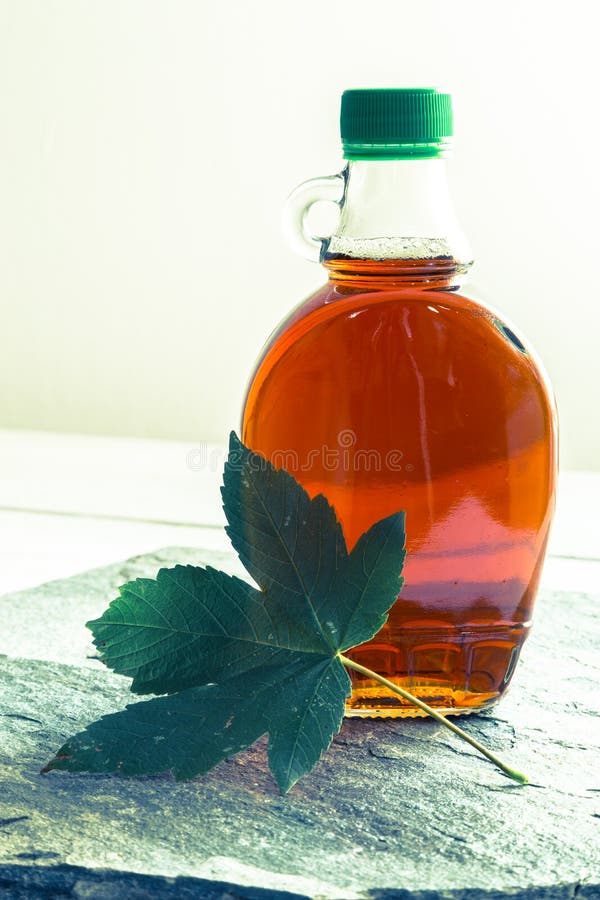Maple Syrup in a Bottle with Maple Leaf Stock Photo - Image of xylem ...