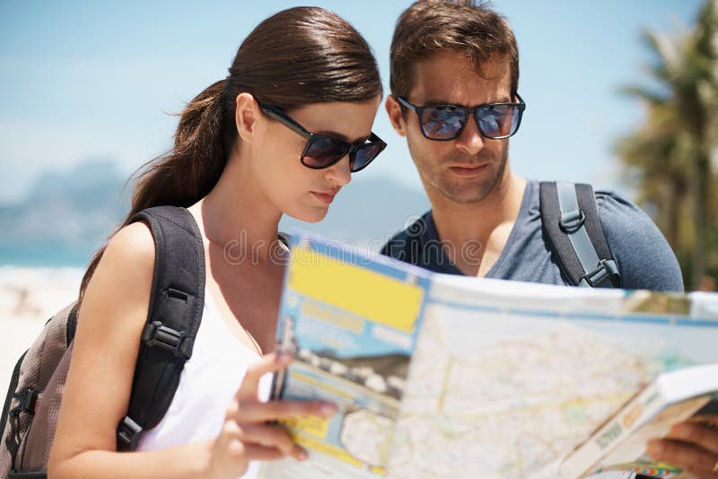 Mapping Out All the Local Attractions. a Young Couple Looking at a Map ...