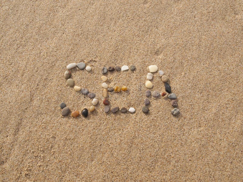 Mar Escrito Com Pedras E Shell Foto de Stock - Imagem de idéia, curso ...