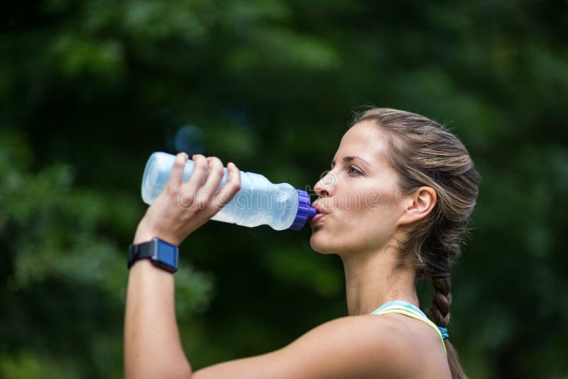 Marathon Female Athlete Running Drinking Water Stock Image - Image of ...