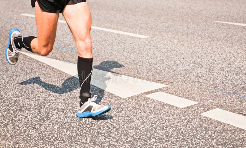 Legs of Man Running on Road Stock Photo - Image of race, competitions ...