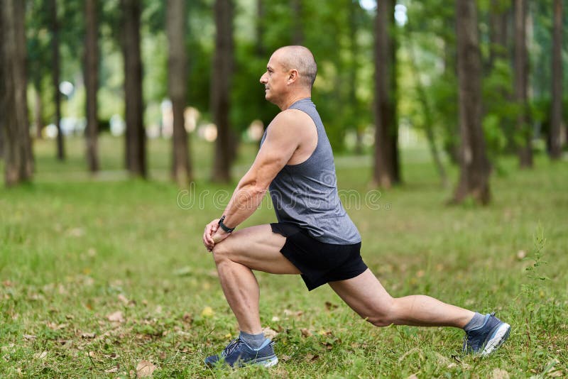 Marathon Runner Stretching and Warming Up Stock Image - Image of ...