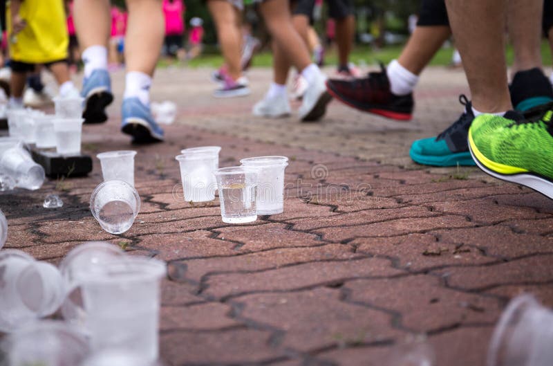 Marathon Runners Feet and Emptry Water Cups on Refreshment Point Stock ...
