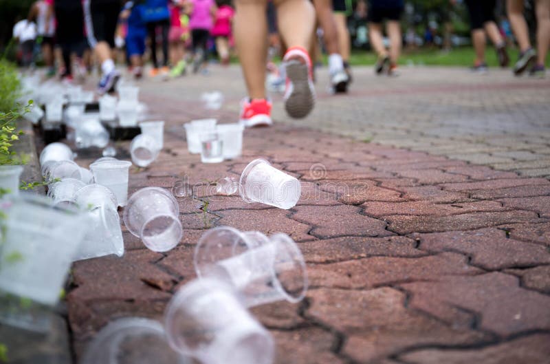 Marathon Runners Feet and Emptry Water Cups on Refreshment Point Stock ...