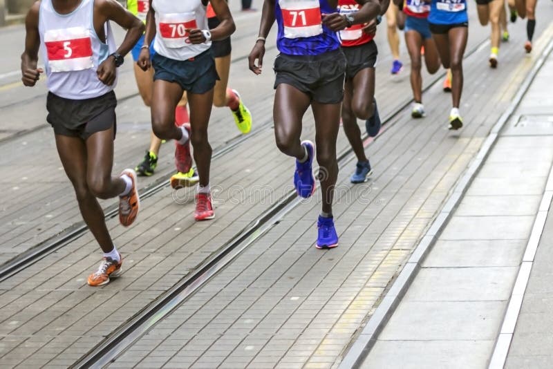 Marathon Runners Race in City Streets Stock Photo - Image of living ...
