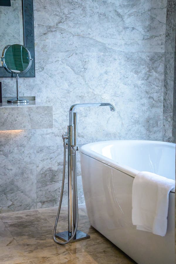 Marble Bathroom with White Bath Tub and Tap and Mirrors and Face Mirror ...