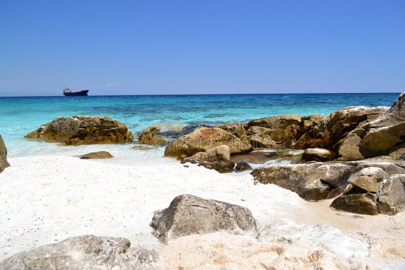 Marble Beach - Rocky Shore 5 Stock Image - Image of boats, holidays ...