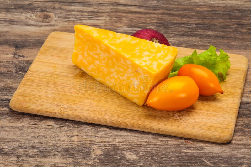 Marble Cheese Triangle Over Wooden Stock Image - Image of milk, pieces ...