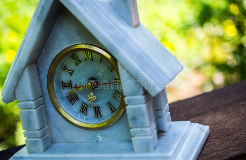 Marble clock on wood stock image. Image of desk, blur - 71797297