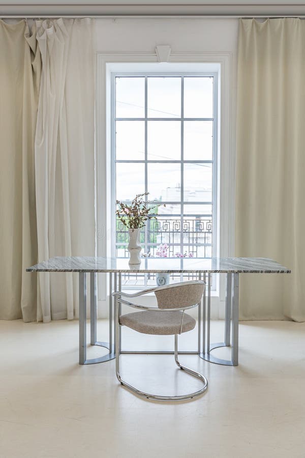 Marble Dining Table and Two Chairs Against the Backdrop of a Panoramic ...