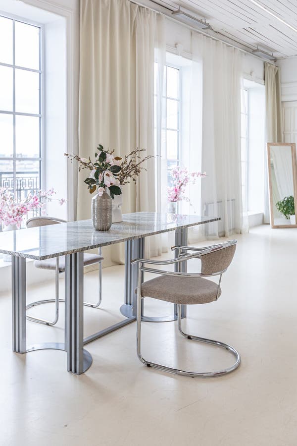Marble Dining Table and Two Chairs Against the Backdrop of a Panoramic ...