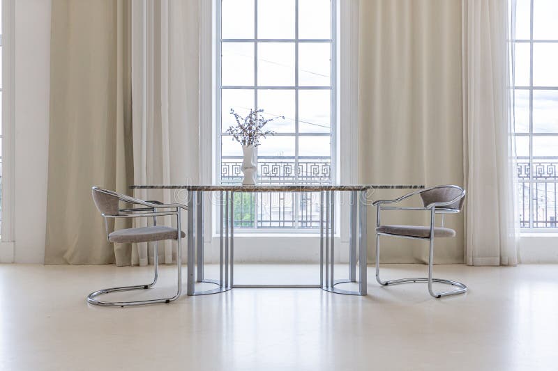 Marble Dining Table and Two Chairs Against the Backdrop of a Panoramic ...