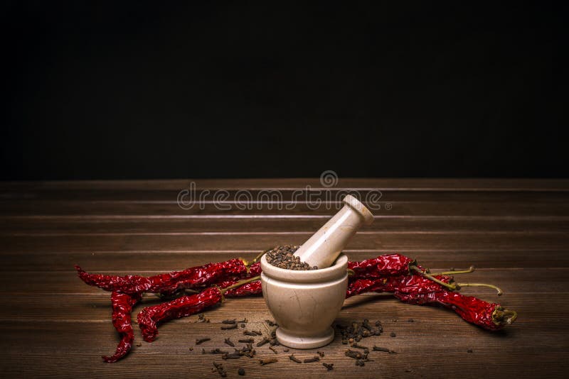 Marble Mortar With Spices Black Pepper, Carnation And Red Hot Pepper ...