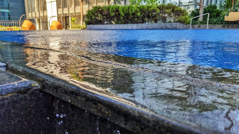 Marble tile poolside stock image. Image of bright, background - 317657487