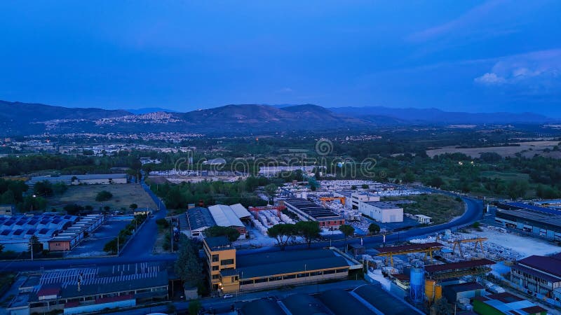 Marble Processing Factory at Dawn with Mountains in Background Stock ...