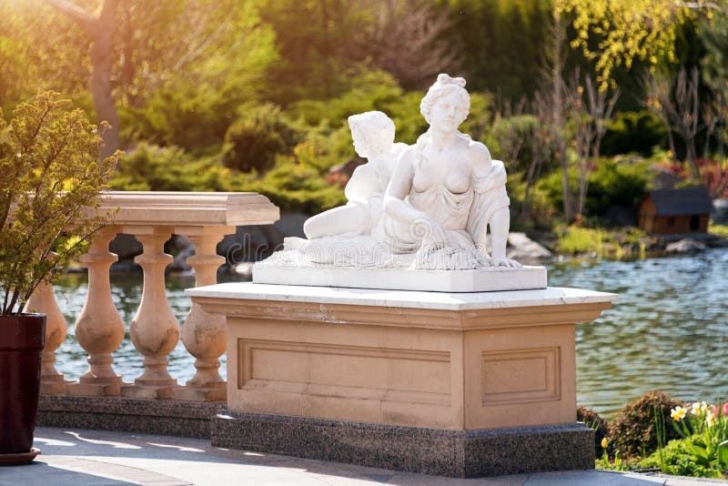 Marble Statue of Greek Goddess and Cupid Stock Photo - Image of build ...