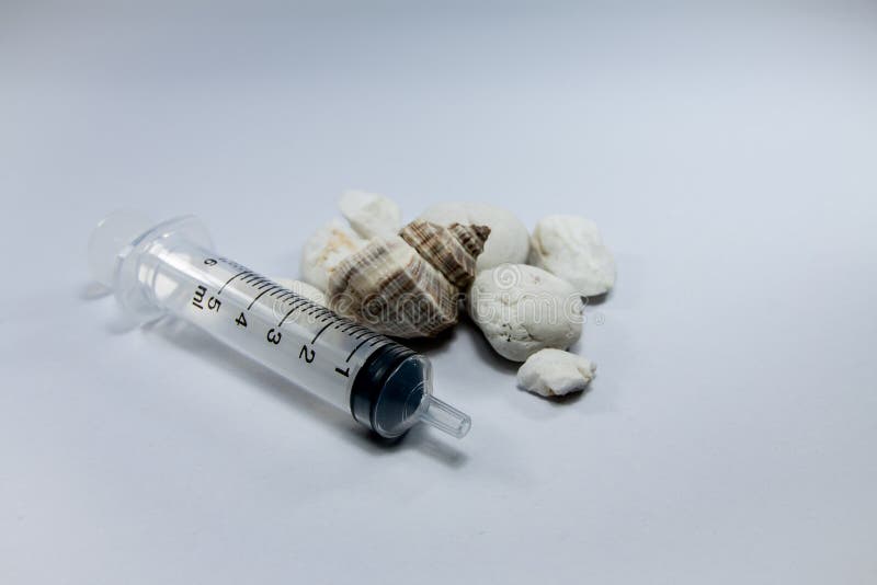 Marble Stone Shell Syringe Objects on the White Background Stock Image ...