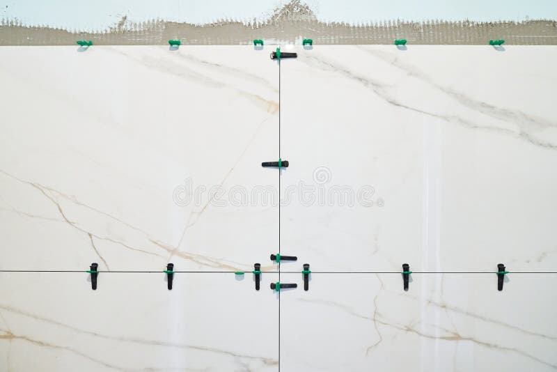 Marble Tiles in the Bathroom Align Large Ceramic Tiles on the Wall ...