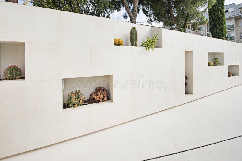 Marble Wall of a Plot with Niches Filled with Various Cacti Stock Photo ...