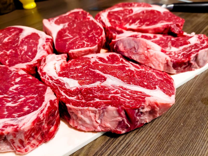 A Marbled Beef Rib Eye Steak is Waiting To Be Grilled Stock Image ...