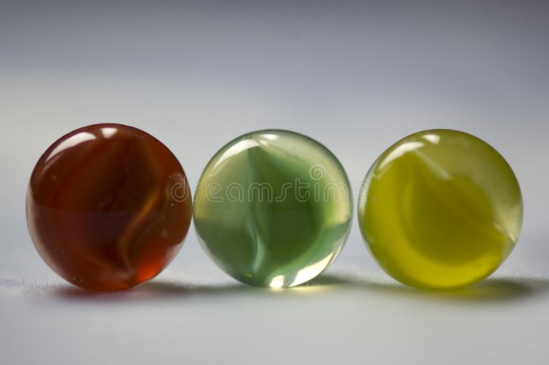 Three marbles stock image. Image of planet, marbles, yellow - 14640129