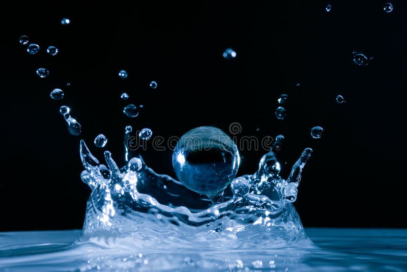 Marbles falling in water. stock photo. Image of water - 4166234