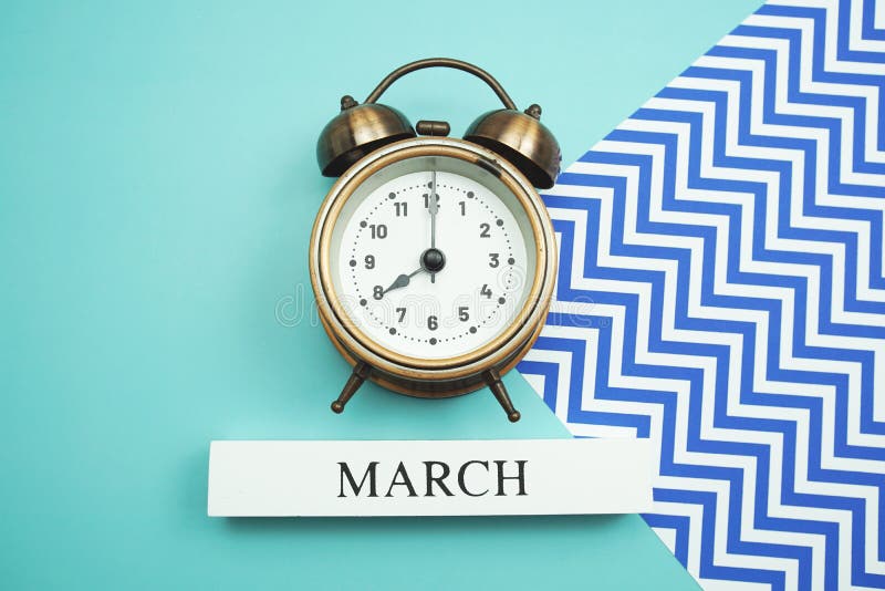 March and Alarm Clock on Blue Background Stock Image - Image of awake ...