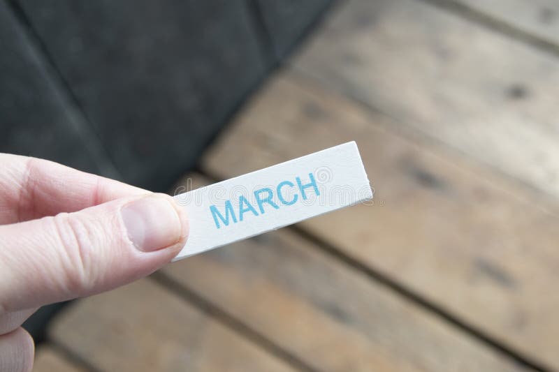 March Concept. a Hand Holds a Sign with an Inscription. Stock Photo ...