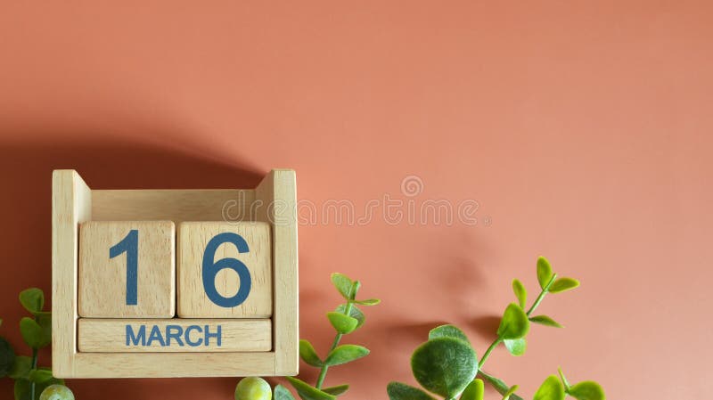March 16, Date Design with Calendar Cube and Leaf on Orange Background ...