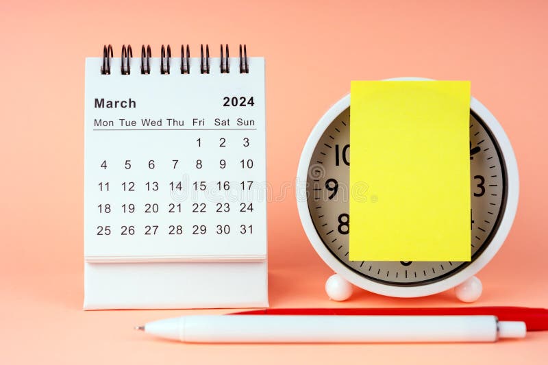 March 2024 Desk Calendar with Alarm Clock and Adhesive Note Stock Image ...