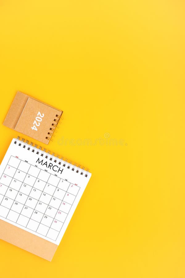 2024 March Desk Calendar on Yellow Background, Position with Copy Space ...