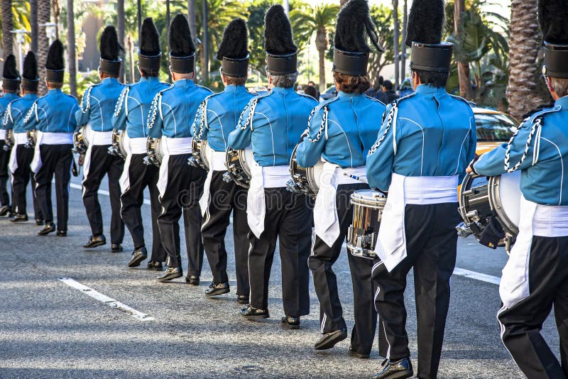 Marching Band with Tubas Dressed in Blue Performing at a Parade ...