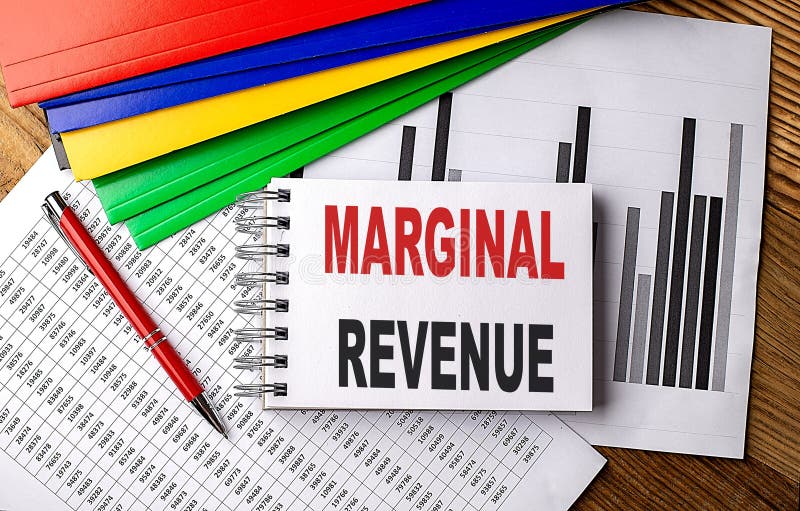 MARGINAL REVENUE Text on Notebook with Folder on Chart Stock Image ...
