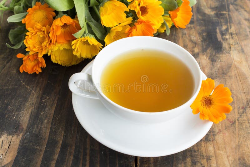 Marigold Tea , Calendula Officinalis Stock Photo - Image of table ...