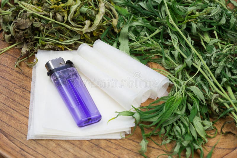 Marijuana and Lighters on a Table Stock Image - Image of natural, ganja ...